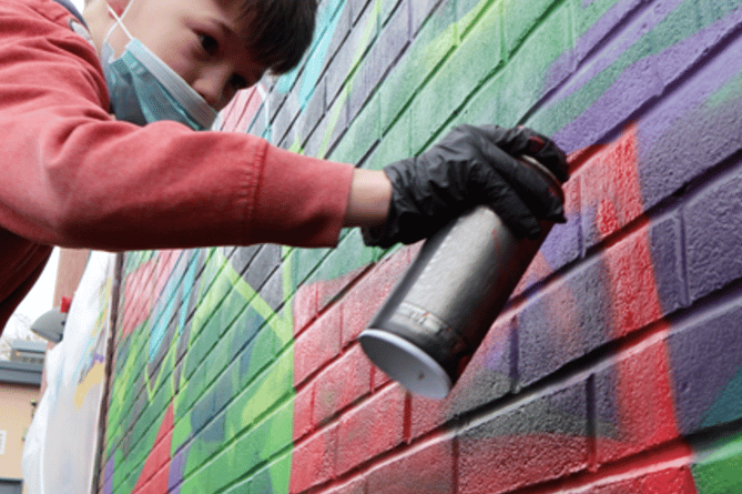Graffiti artist helps pupils create mural for Clyro Church in Wales ...